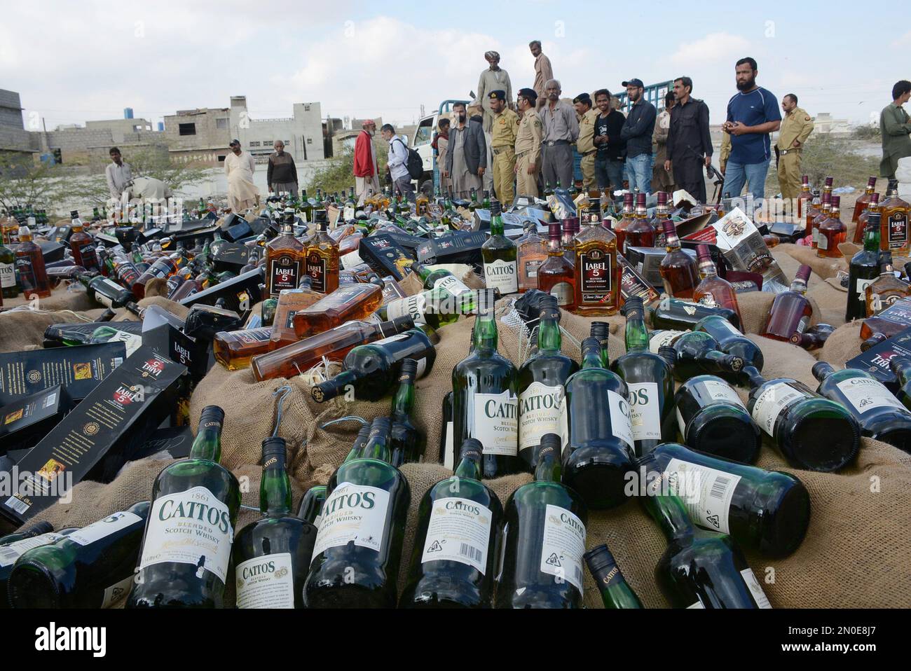 Pakistani customs officials get ready to destroy confiscated liquor ...