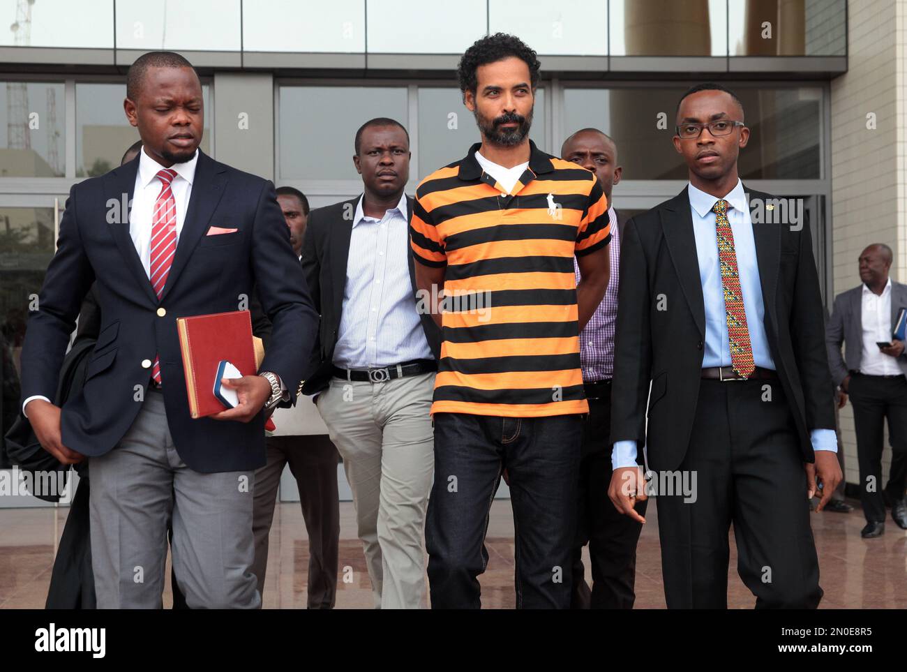 Arthur Simpson-Kent, second right, after his appearance for extradition ...