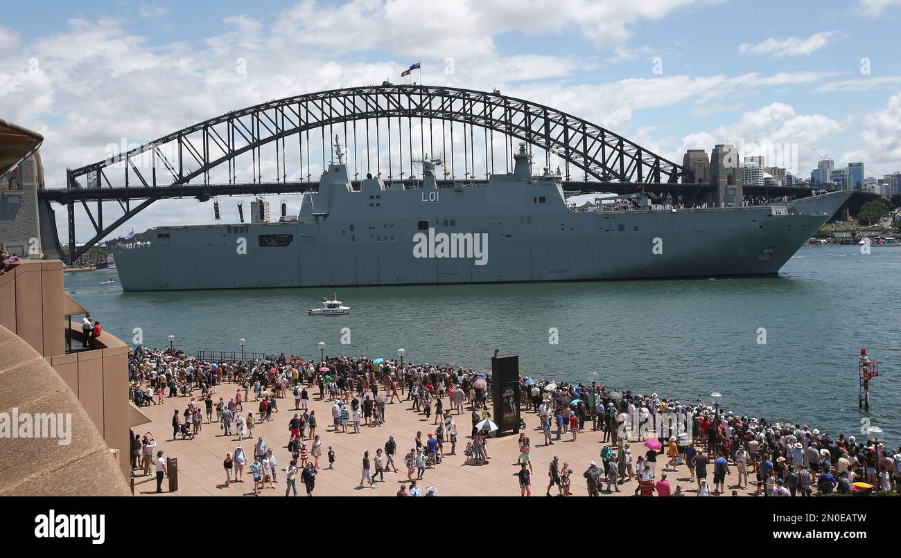 HMAS Adelaide sails past the Sydney Harbour Bridge during Australia Day ...