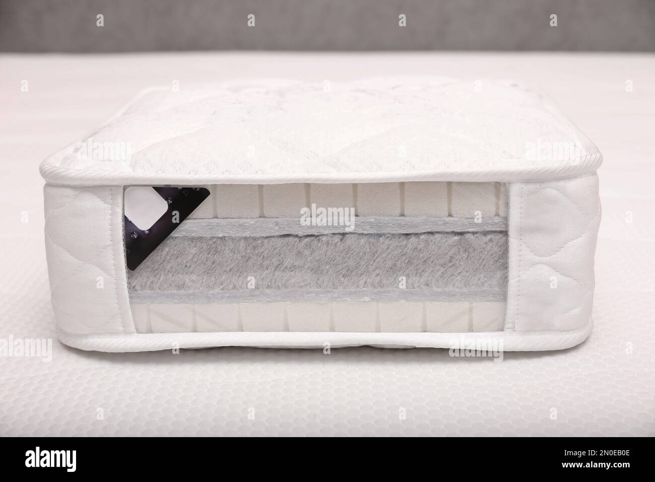 Sample of modern orthopedic mattress on textile Stock Photo - Alamy