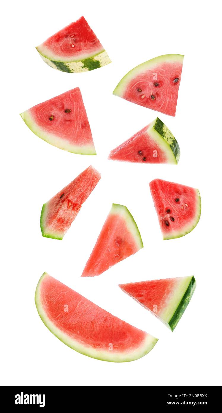 Fresh watermelon pieces falling on white background Stock Photo - Alamy