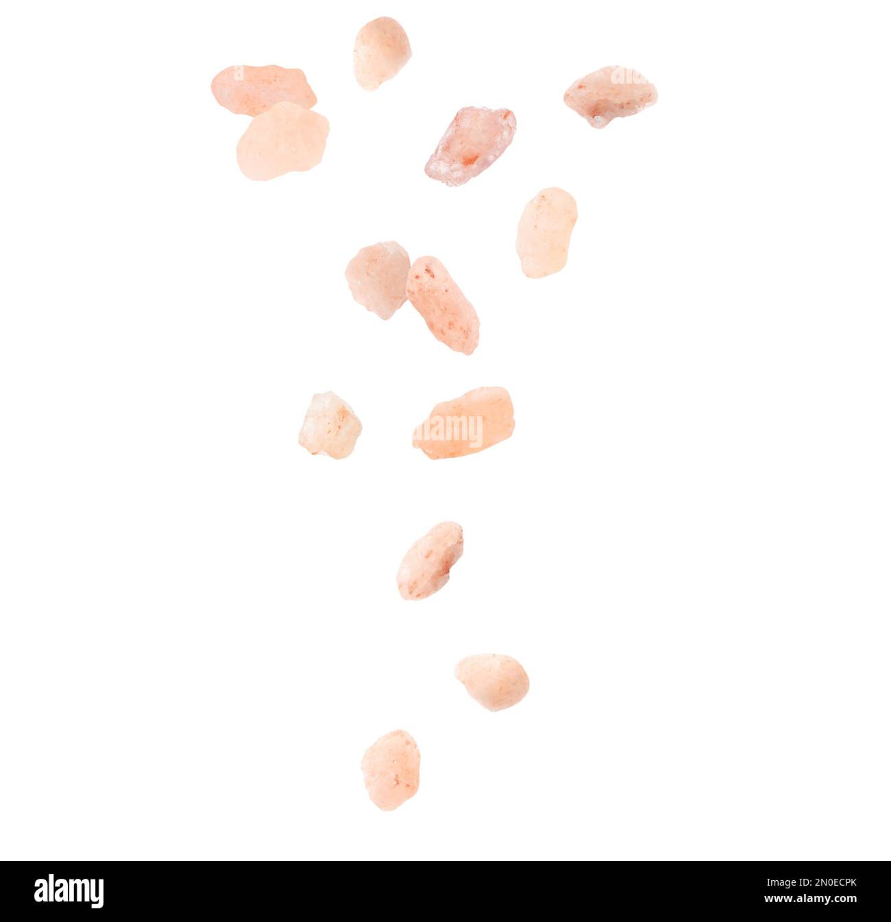 Pink himalayan salt falling on white background Stock Photo - Alamy