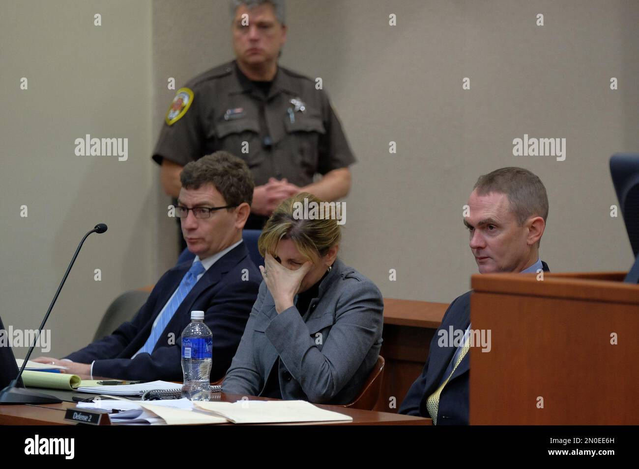Defense attorney Megan Thomas, C, gets emotional as Judge Randy Bellows ...