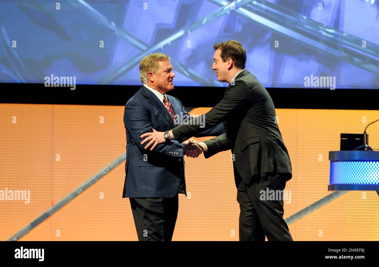 Current NASCAR Sprint Cup Champion Kyle Busch shakes hands with ...