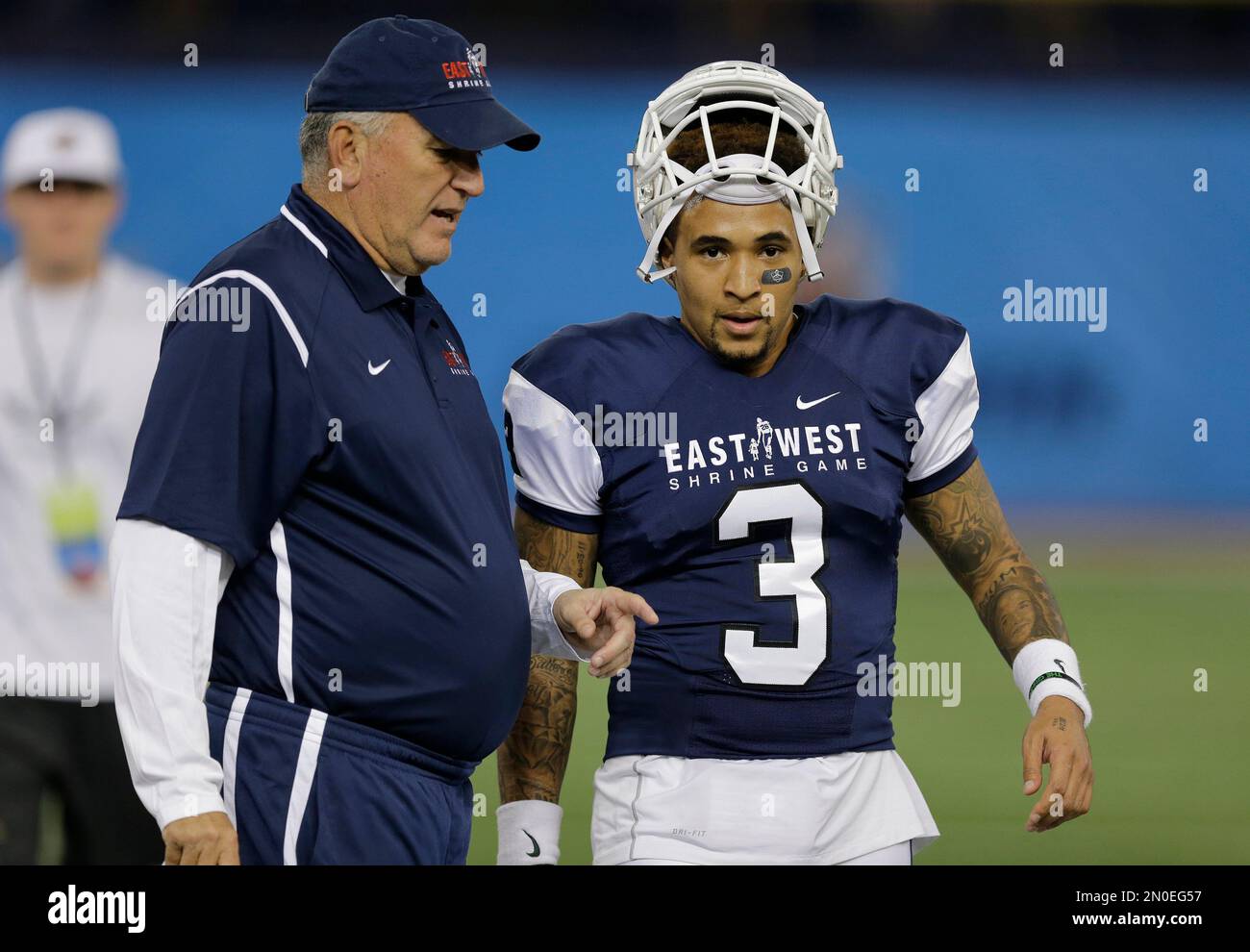West quarterback Vernon Adams Jr., (3), of Oregon, talks to head cosh ...