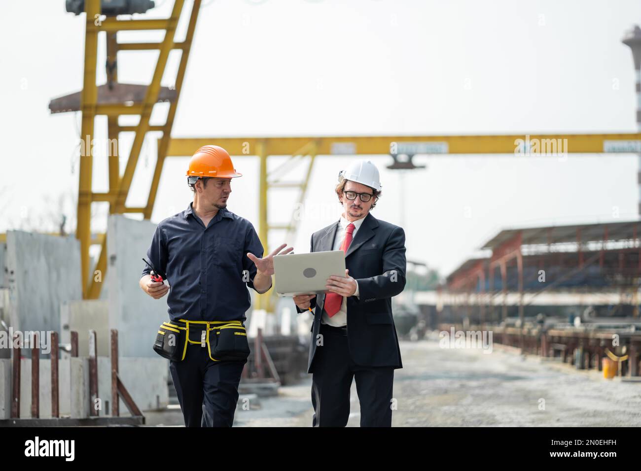 Male engineers are inspecting and controlling the work of the employees ...