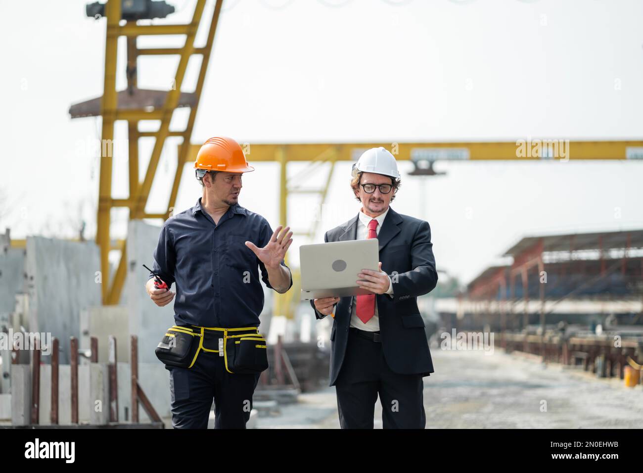 Male engineers are inspecting and controlling the work of the employees ...