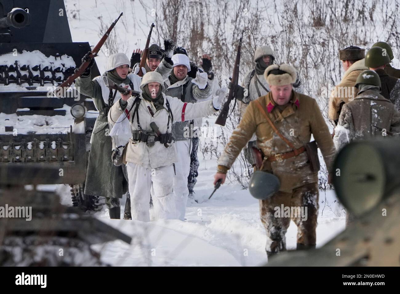 Historical re-enactors dressed Nazi German, left, and Soviet Red armies ...