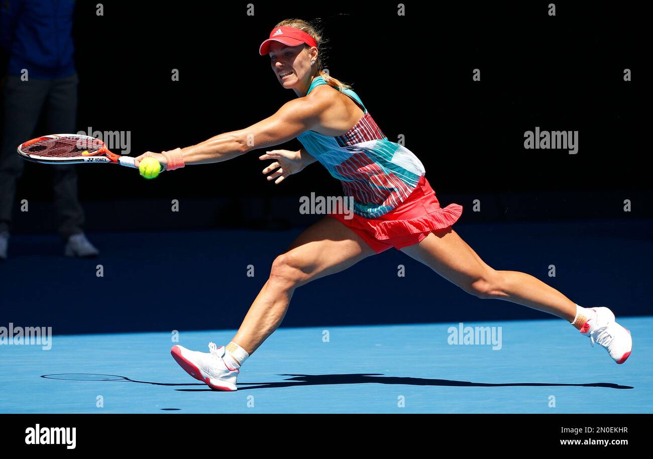 Angelique Kerber of Germany hits a backhand return to compatriot Annika ...