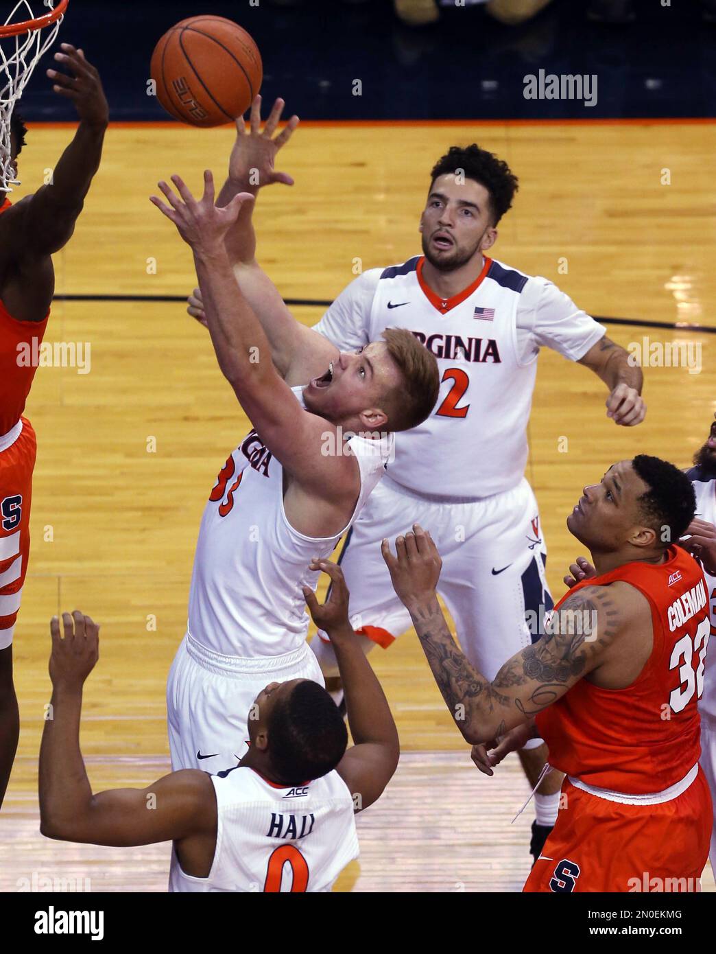 Virginia center Jack Salt (33) grabs the rebound in front of Syracuse ...