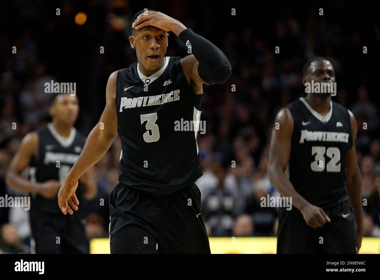 Providence's Kris Dunn, center, reacts to fouling out during overtime ...