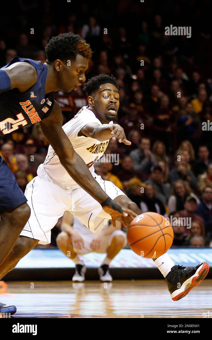Illinois guard Kendrick Nunn (25) drives the ball away from Minnesota ...