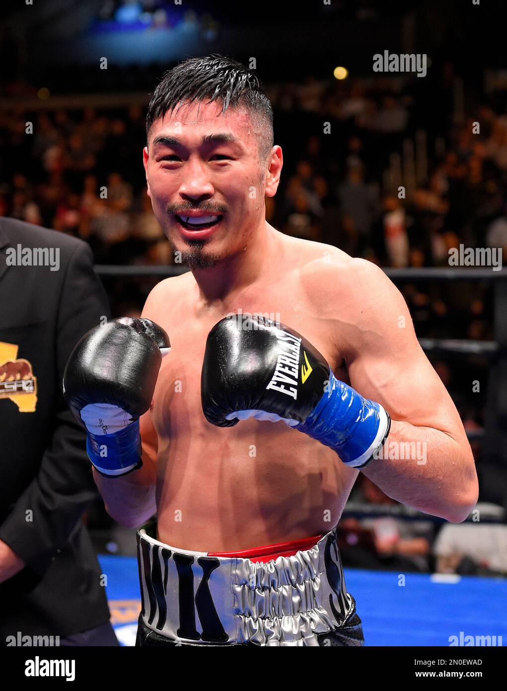 Kim Min Wook, of South Korea, poses after defeating Erick Martinez, of ...