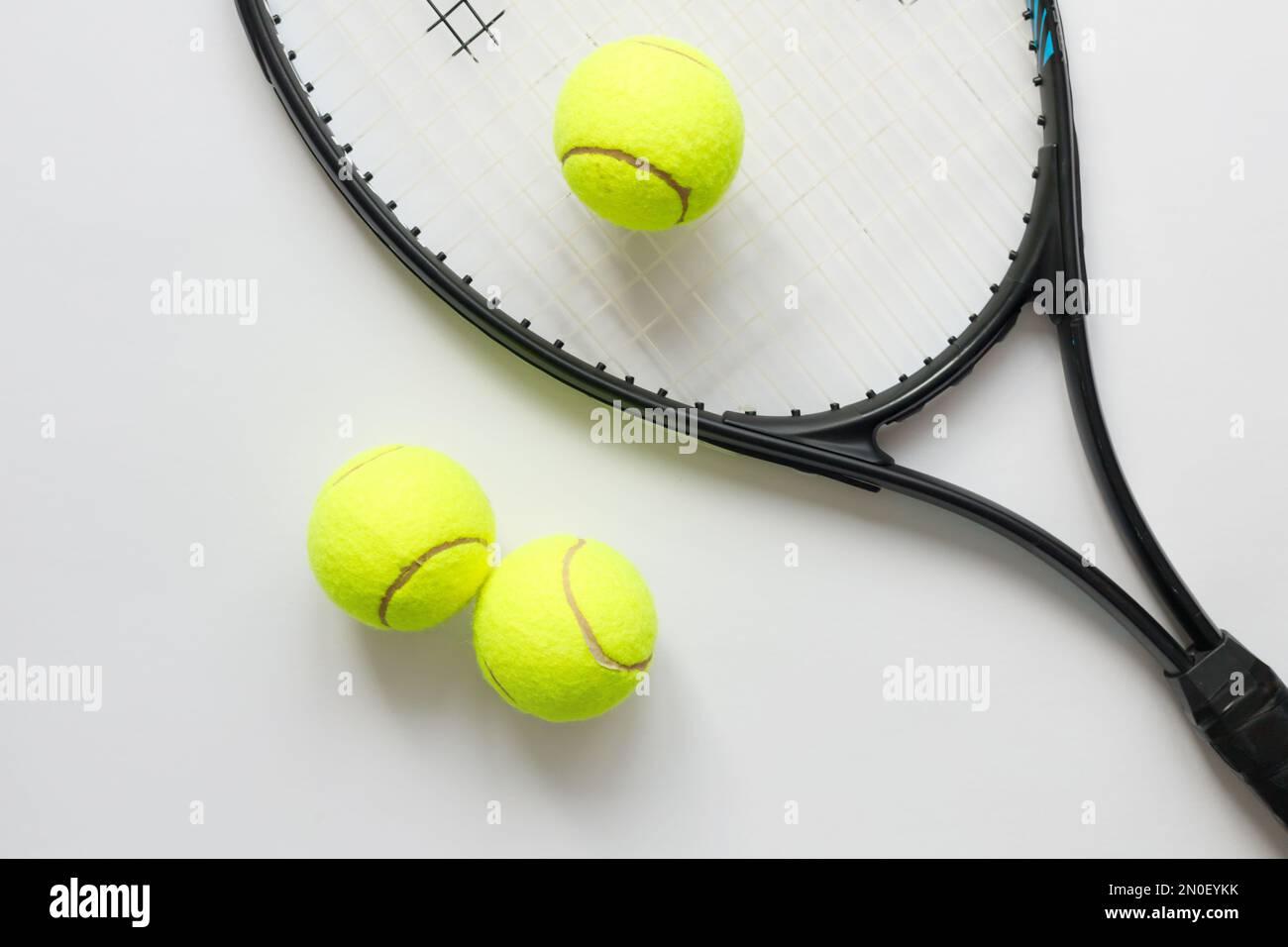 Big tennis sports equipment, racket and balls, layout on a white ...