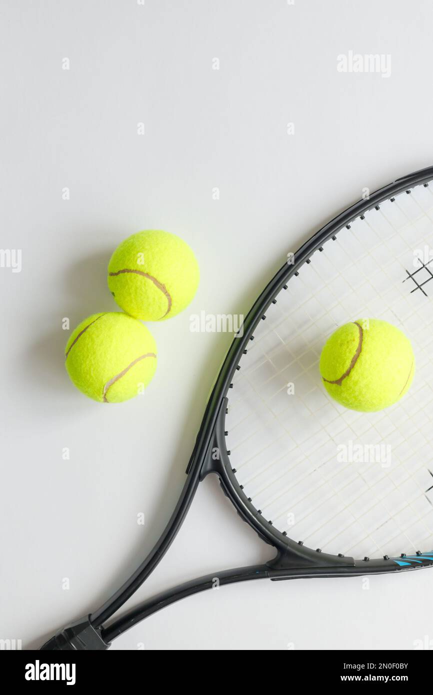 Big tennis sports equipment, racket and balls, layout on a white ...
