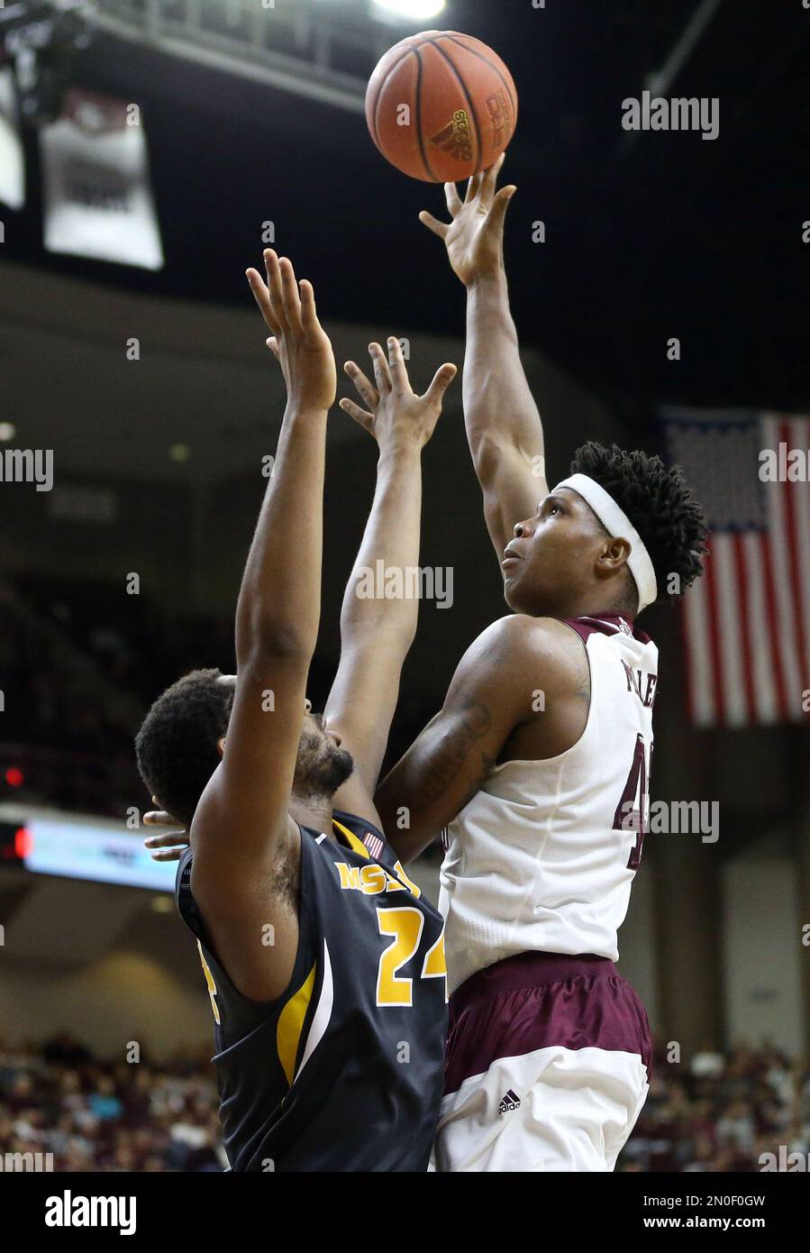 Texas A&M's Tavario Miller (42) makes a short jump shot over Missouri's ...