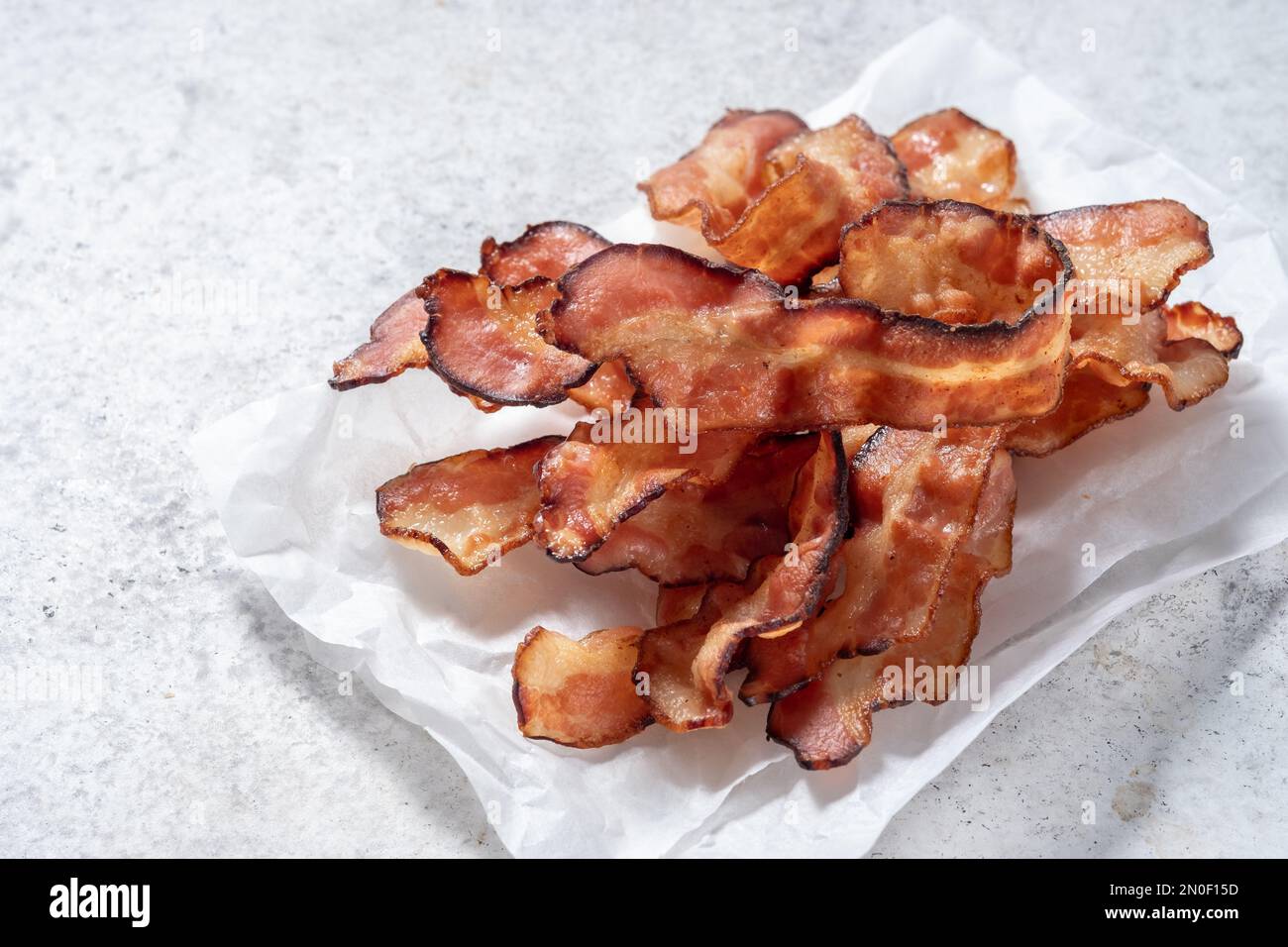 Cooked bacon rashers on parchment Stock Photo - Alamy