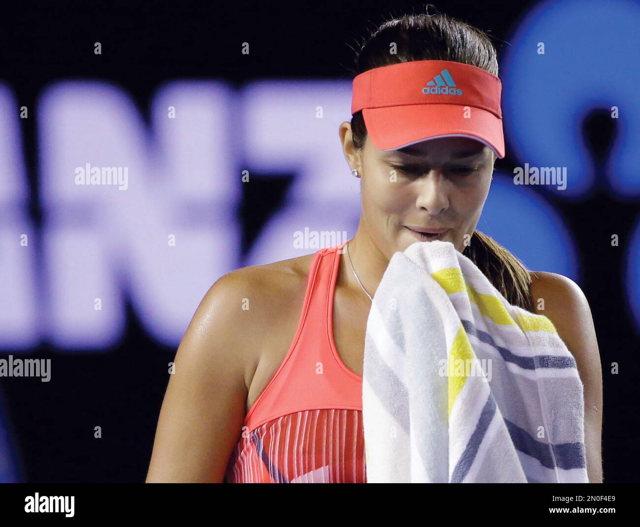 Ana Ivanovic of Serbia wipes the sweat from her face during her third ...