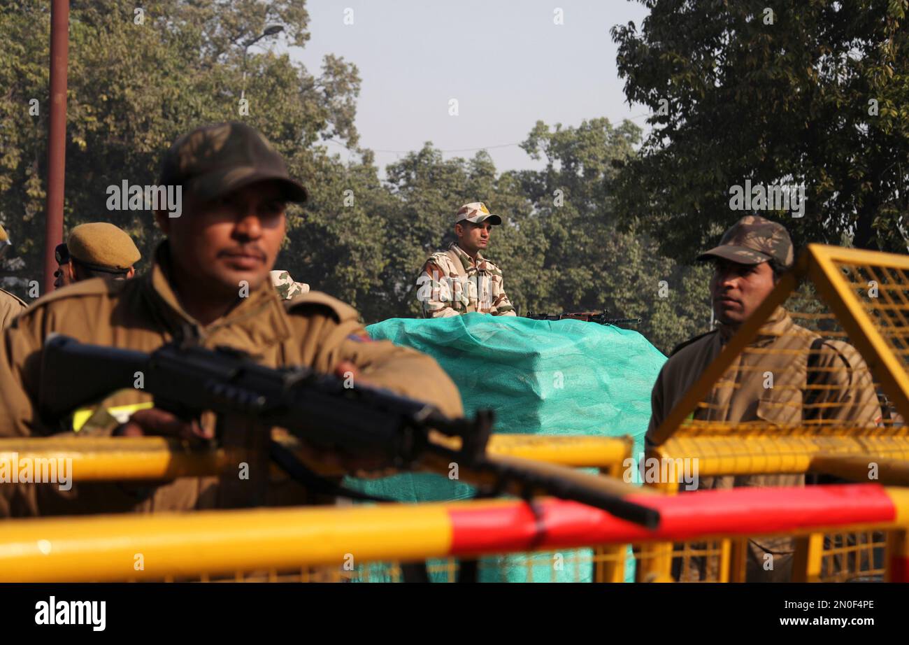 Indian security personnel stand guard at a checkpoint during the full ...