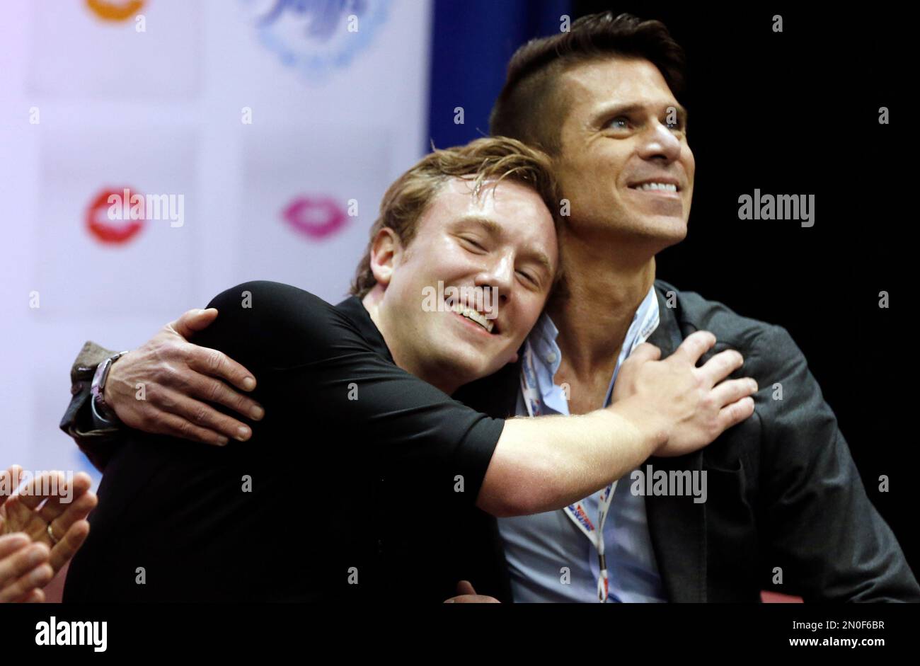Ross Miner, left, gets a hug from coach Mark Mitchell after he ...