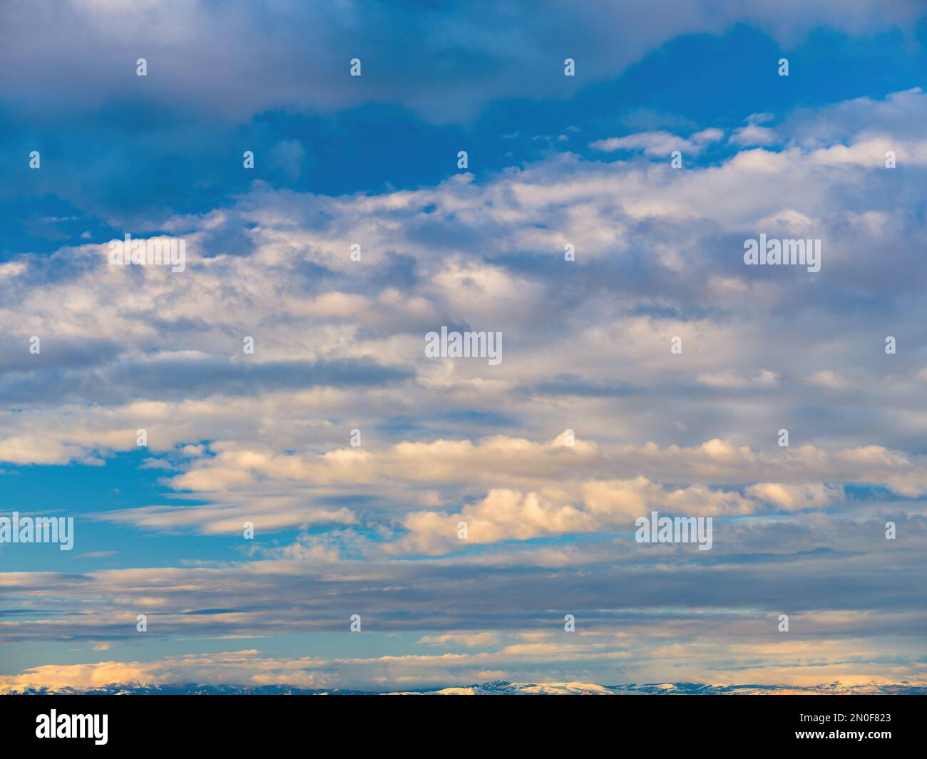Morning clouds in layers over the land Stock Photo - Alamy