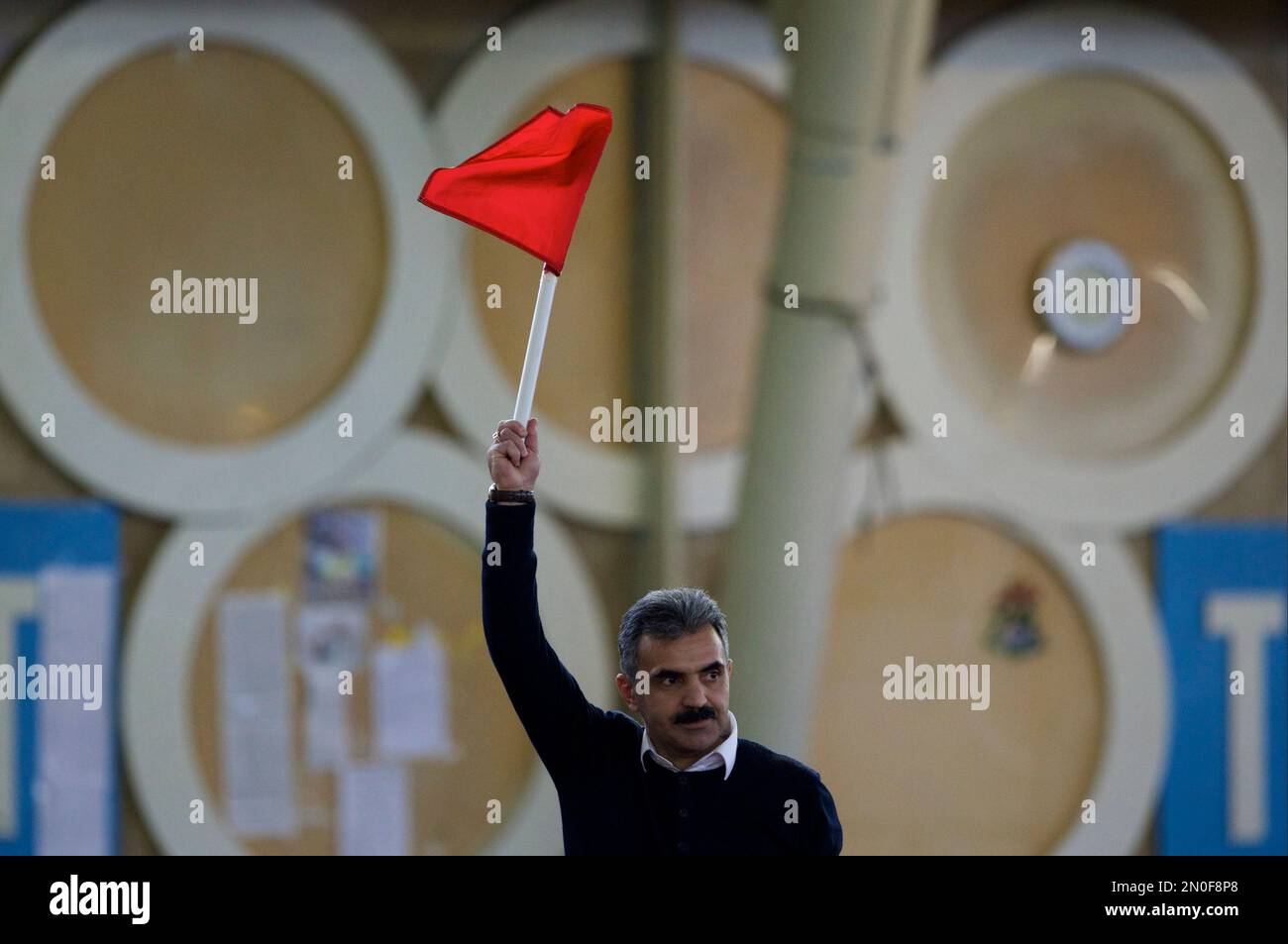 Referee Oktai Mirzoyev holds a red flag showing a failed attempt at the ...