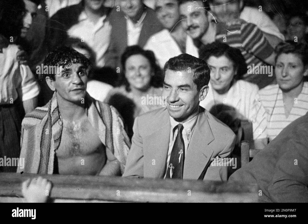 New York mobster Lucky Luciano attends a boxing match at Vomaro Stadium ...