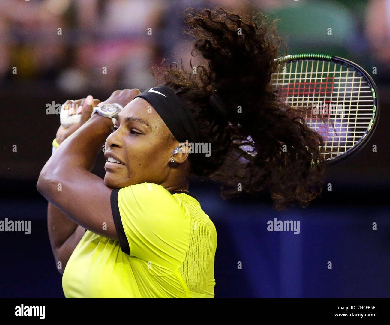 Serena Williams of the United States hits a backhand return to Daria ...