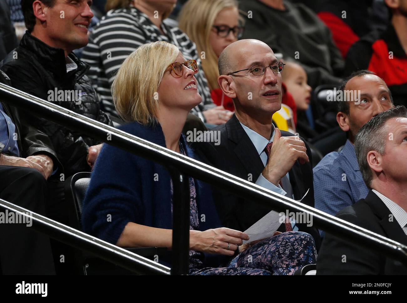 NBA Commissioner Adam Silver, right, joined by his wife in the stands ...