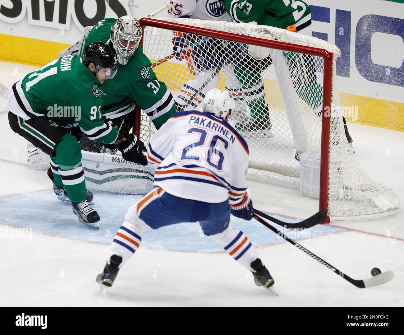 Dallas Stars goalie Antti Niemi (31) and center Tyler Seguin (91) stop ...