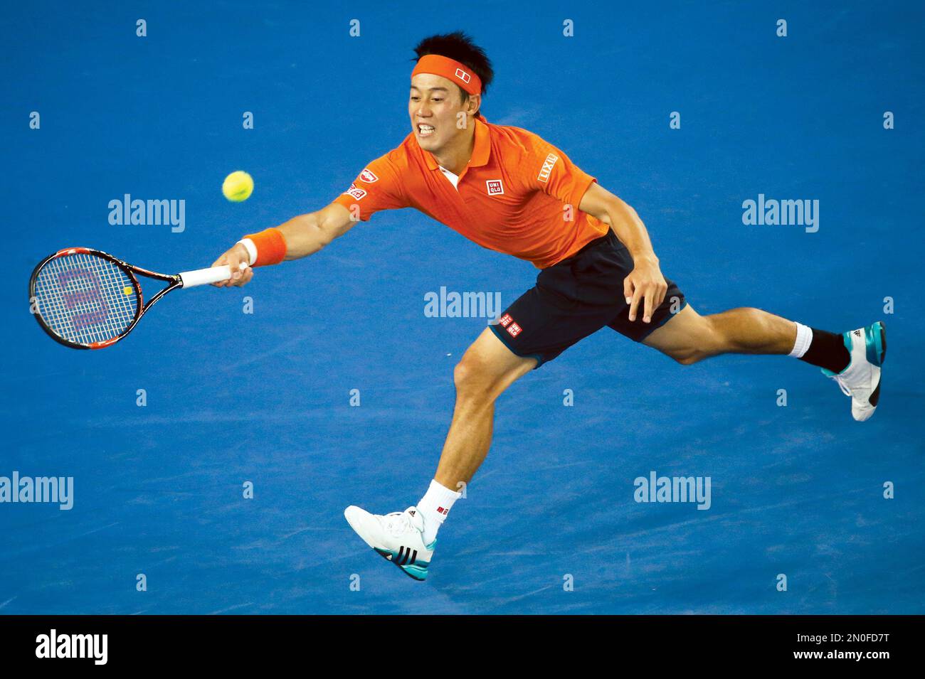 Kei Nishikori of Japan hits a forehand return to Guillermo Garcia-Lopez ...