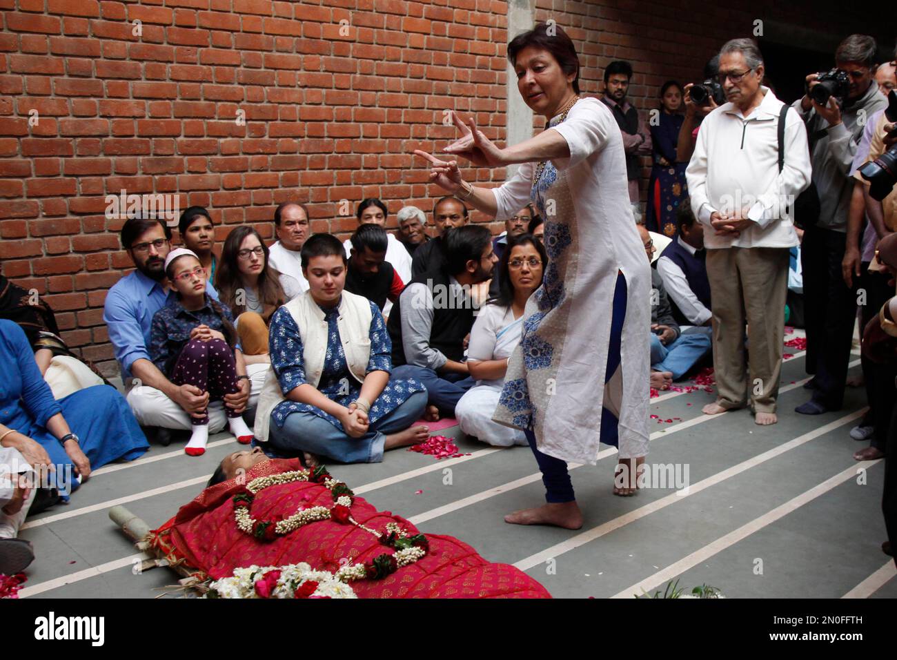 Dancer Mallika Sarabhai performs a classical dance in front of the body ...