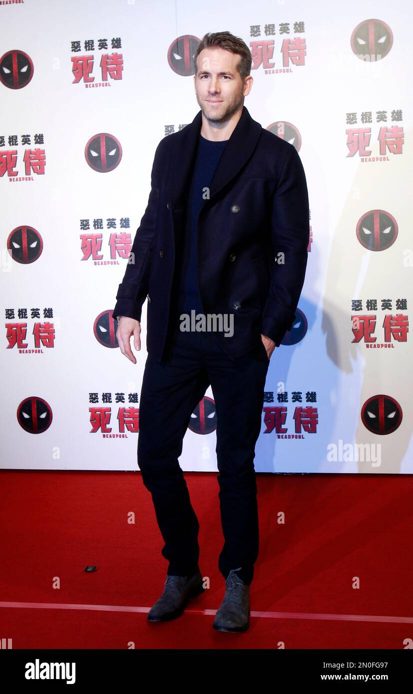 Canadian actor Ryan Reynolds poses for press before the premier of his ...