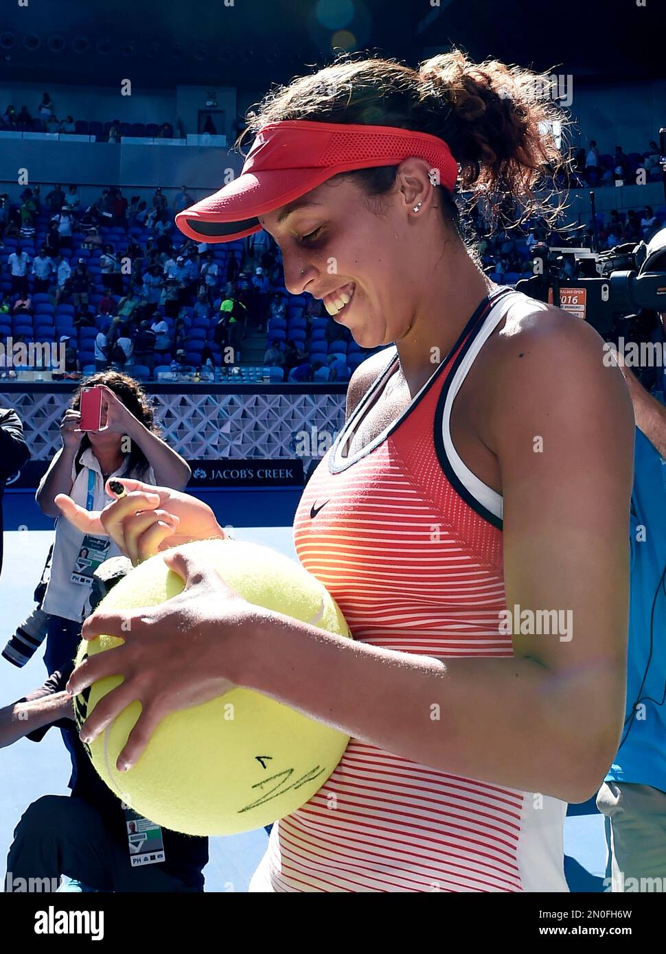 Madison Keys of the United States signs her autograph for fans after ...