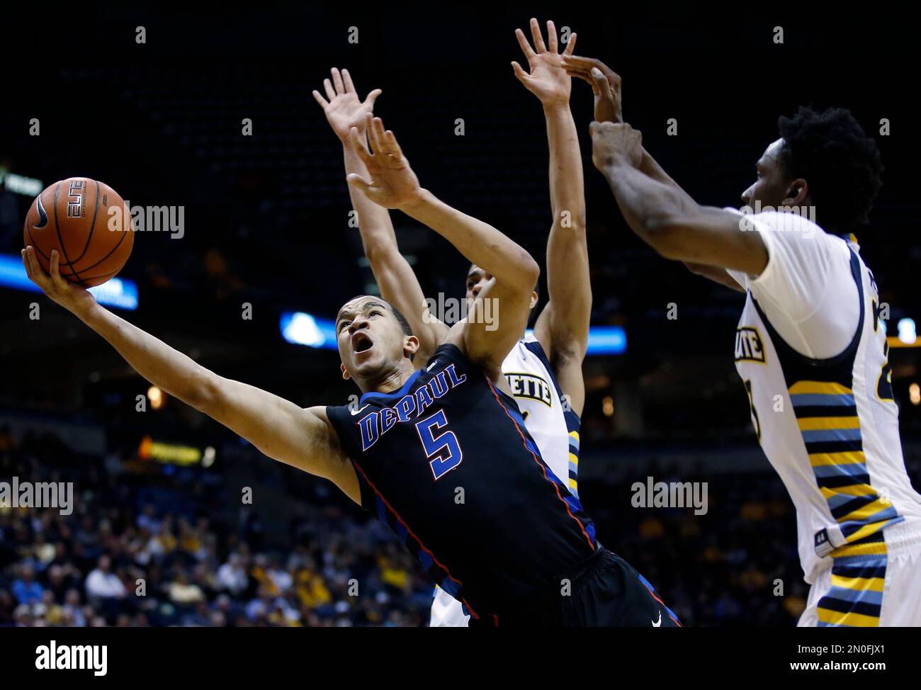 DePaul's Billy Garrett Jr. shoots against Marquette's Haanif Cheatham ...