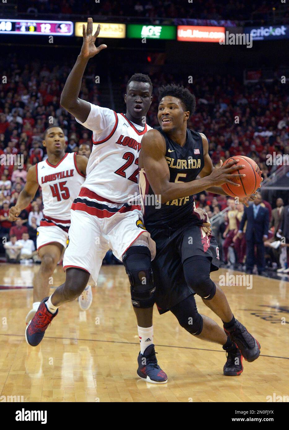 Florida State's Malik Beasley (5) attempts to drive around Louisville's ...