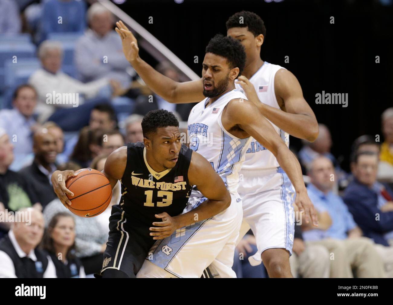 North Carolina's Joel Berry II and Isaiah Hicks defend against Wake ...