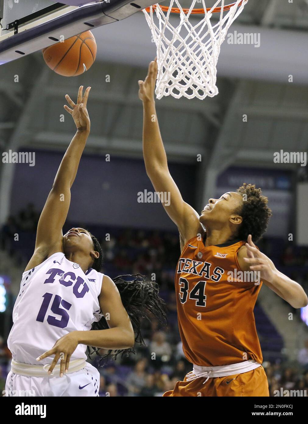 TCU forward Jada Butts (15) attempts a layup as Texas forward Imani ...