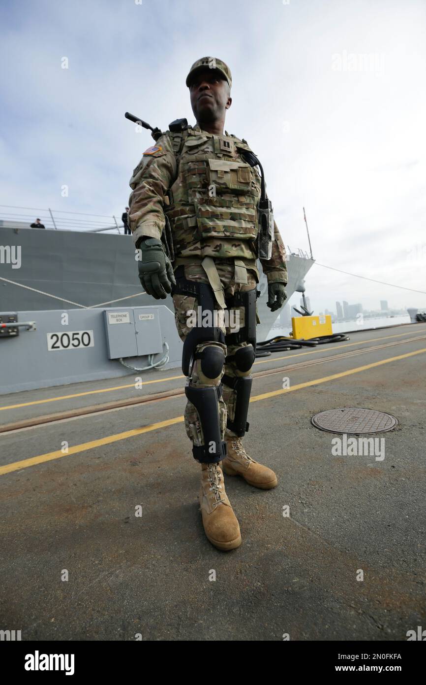 Marine Capt. Al LeCounte displays a prototype leg apparatus designed to ...