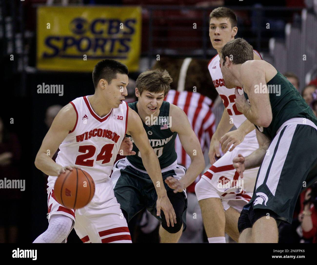 Wisconsin's Bronson Koenig (24) and Michigan State's Matt McQuaid (20 ...