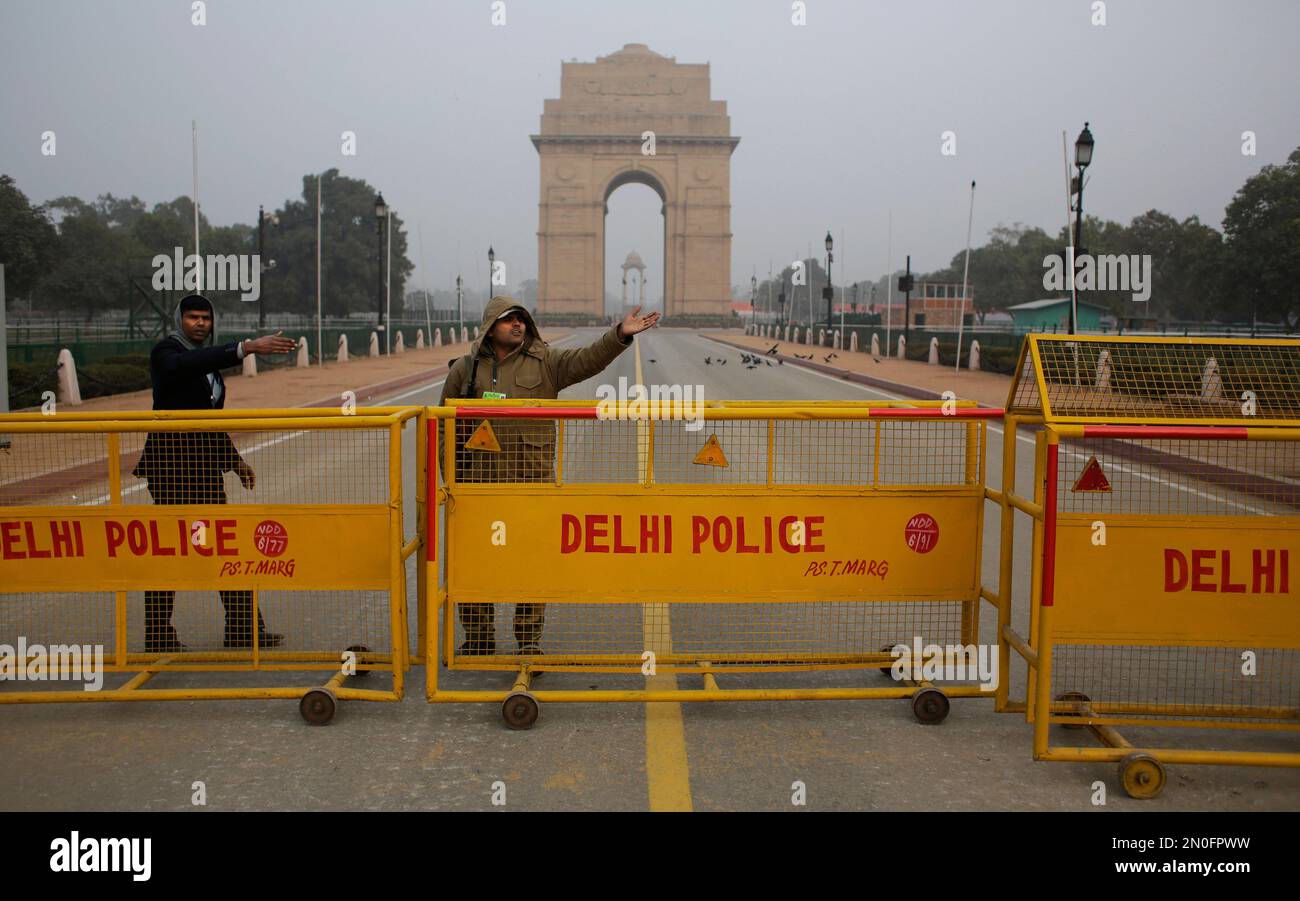 Indian security personnel asks visitors to disperse from near a police ...