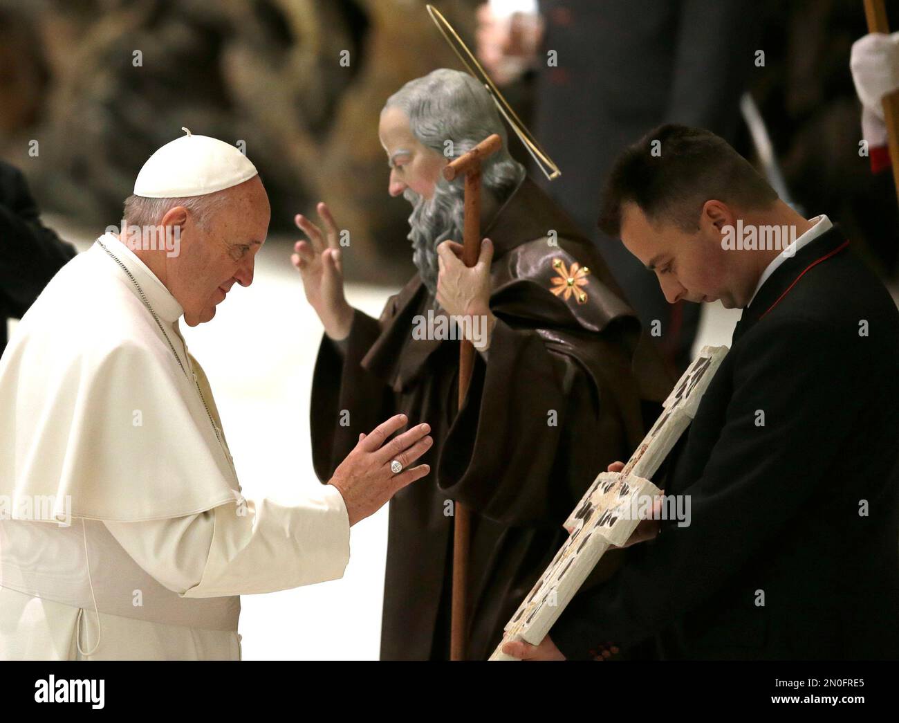 Pope Francis blesses a crucifix and a statue at the end of his weekly ...