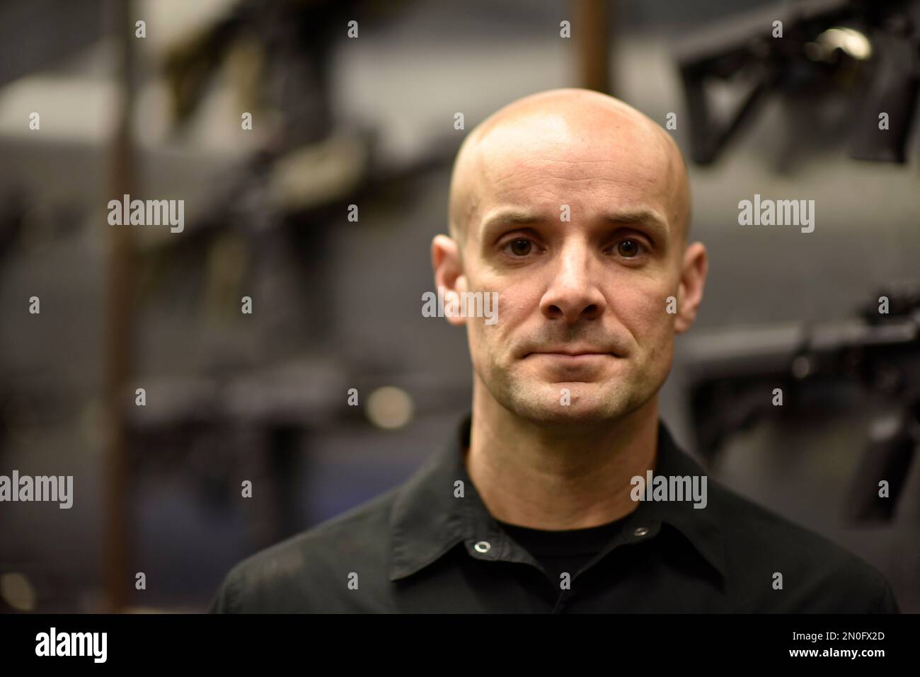 Adam Painchaud, the vice president of Sig Sauer Academy, poses for a ...