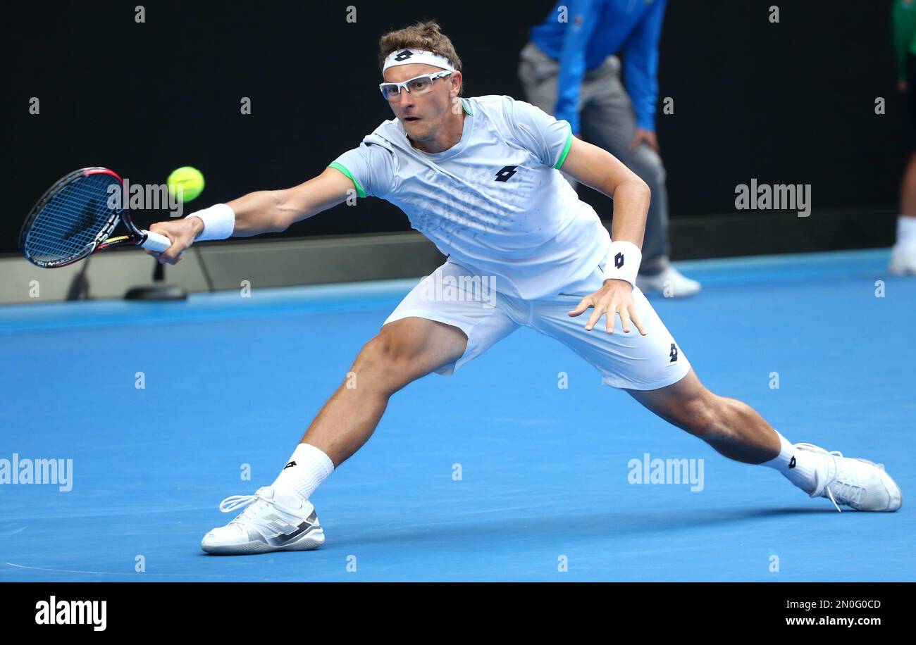 Denis Istomin of Uzbekistan makes a forehand return during his first ...