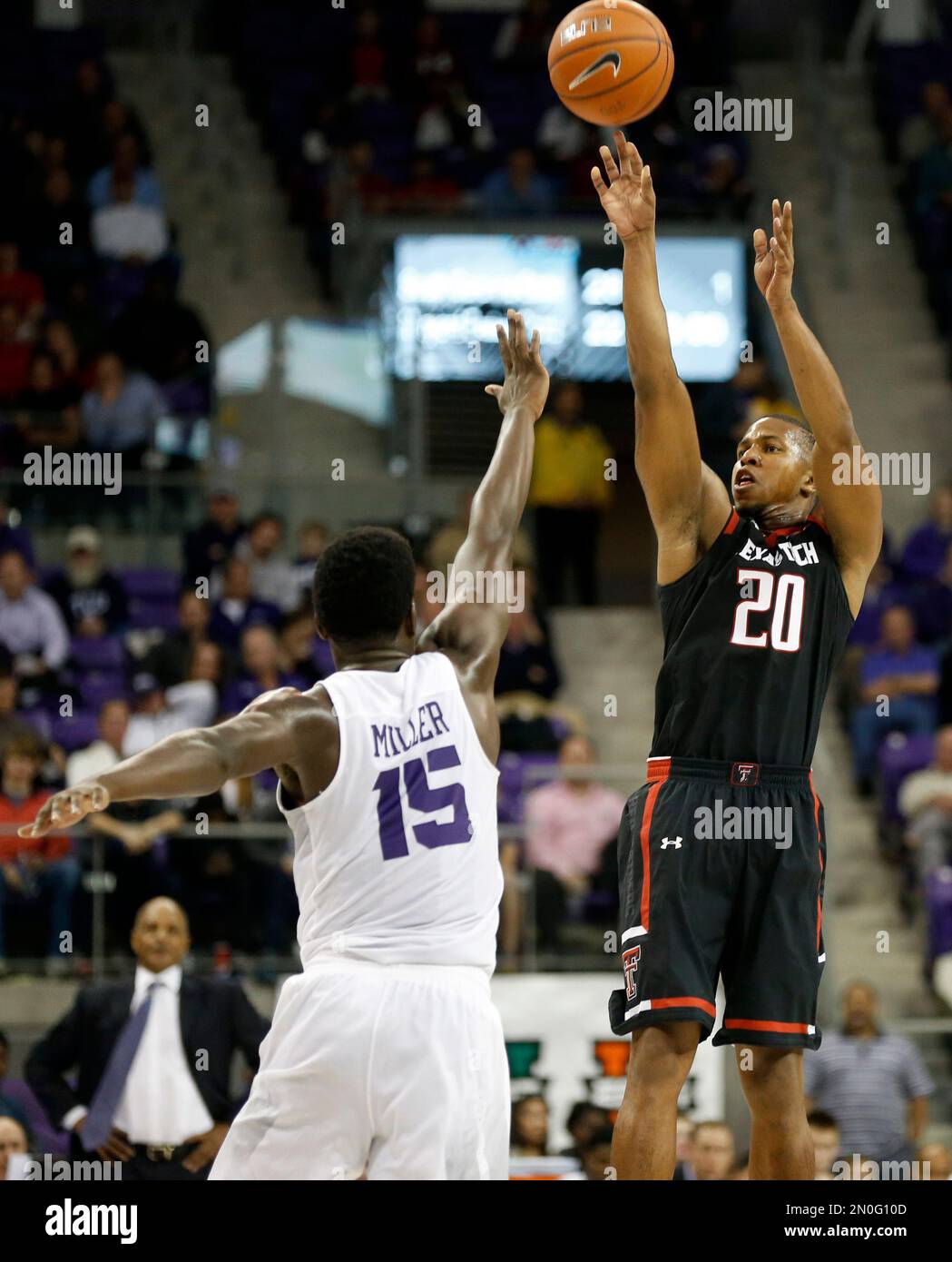 Texas Tech guard Toddrick Gotcher (20) shots over TCU forward JD Miller ...