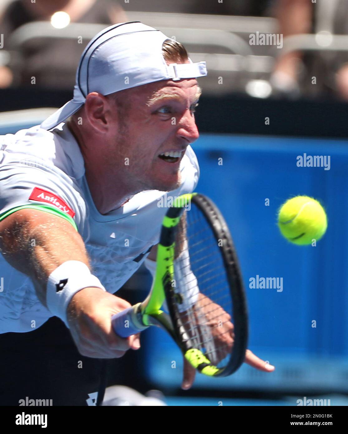 Sam Groth of Australia reaches for a forehand volley during his first ...