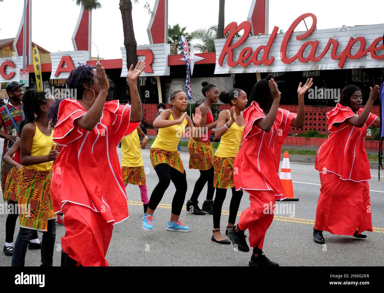 A group of dancers parade down Martin Luther King Blvd. during the ...
