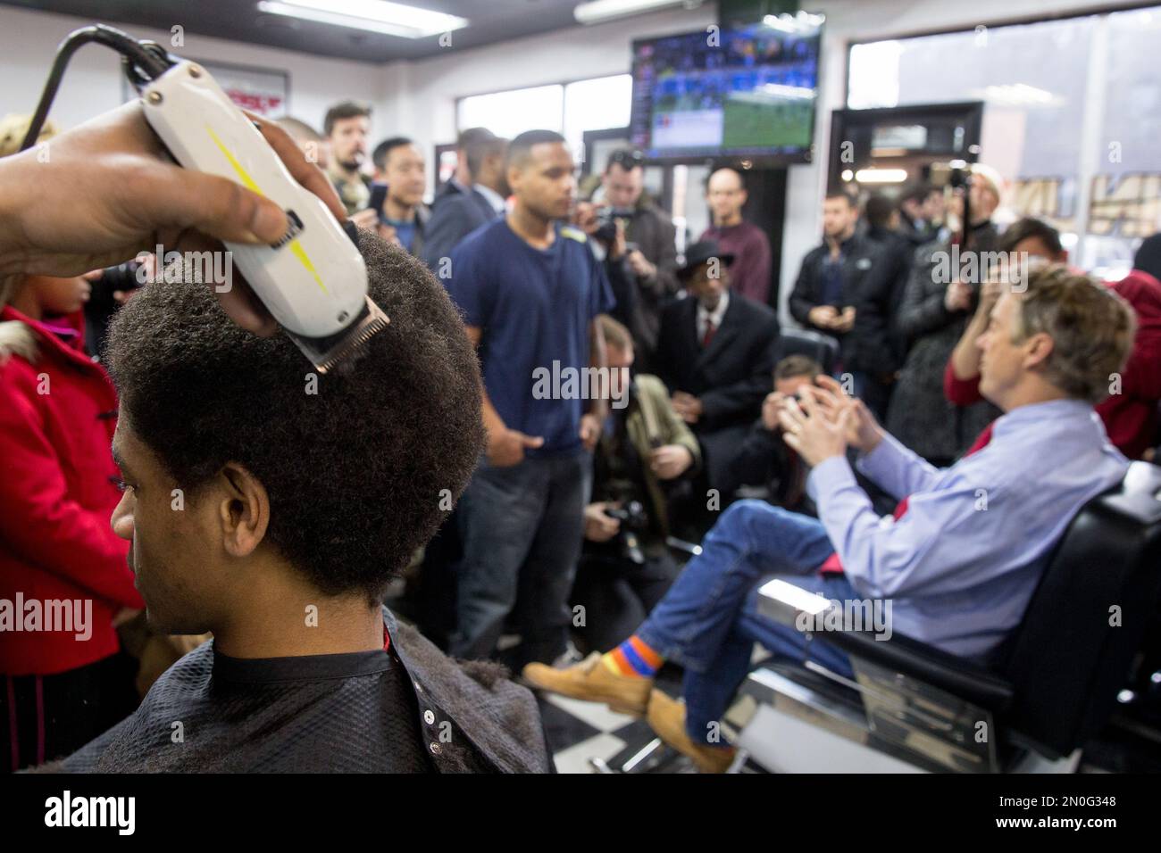 J.T. Kramer of Des Moines, Iowa, left, gets a haircut as Republican ...