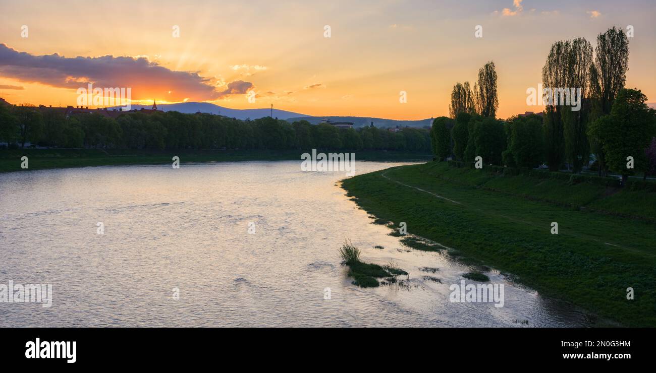 gorgeous sunrise on the waterfront of river uzh. beautiful urban ...