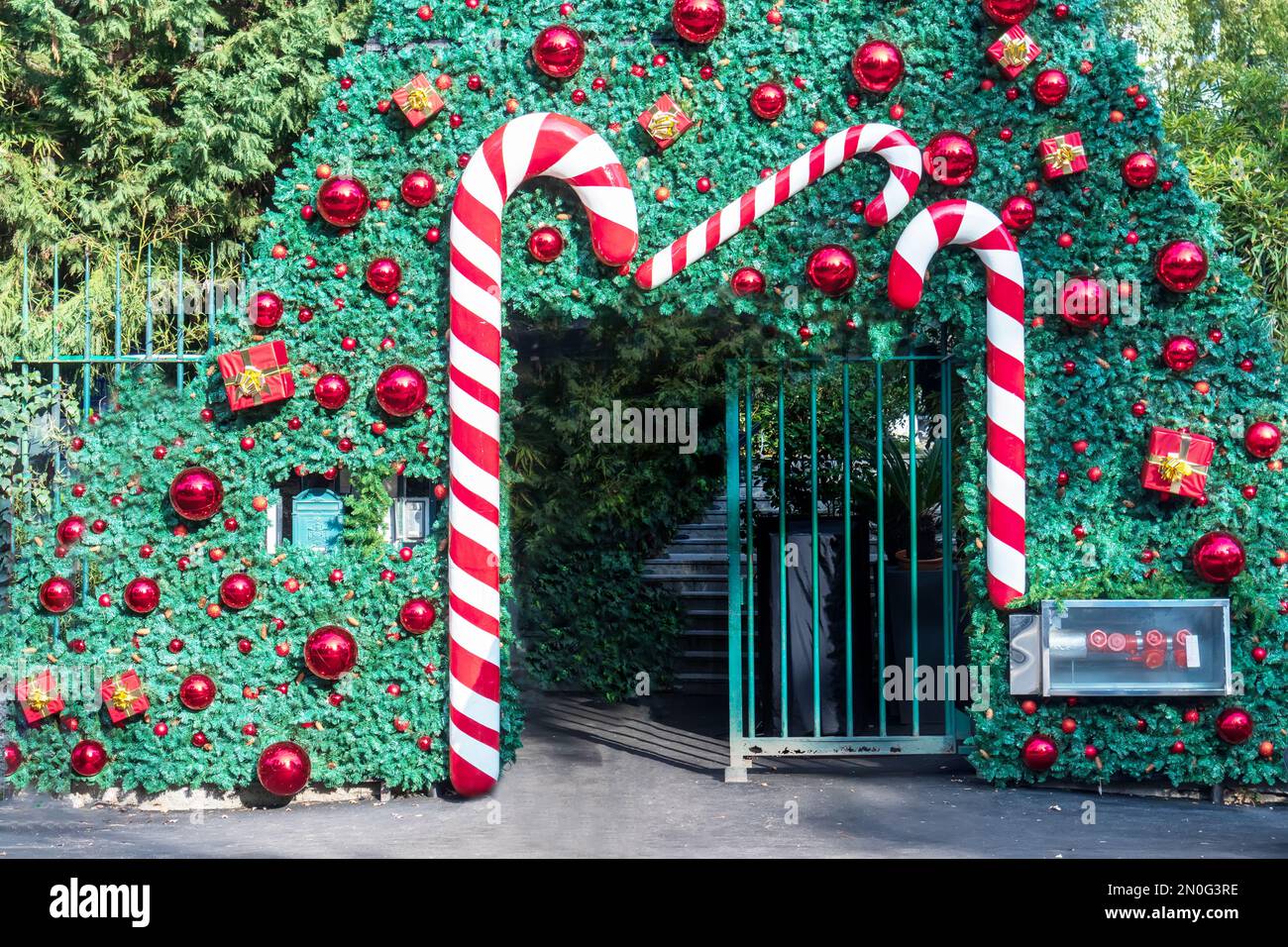 Decorated backyard fence with red balls of different sizes and red and ...